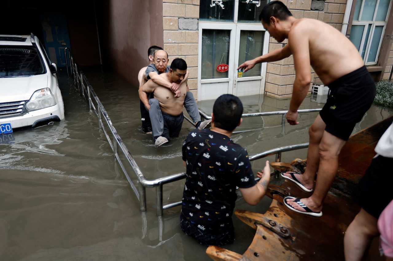 Floods test China's disaster-response systems as emergency level raised ...